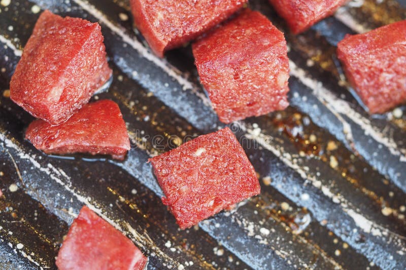 Frozen Beef Cubes Ready for Cooking on a Grill Surface Stock Image ...