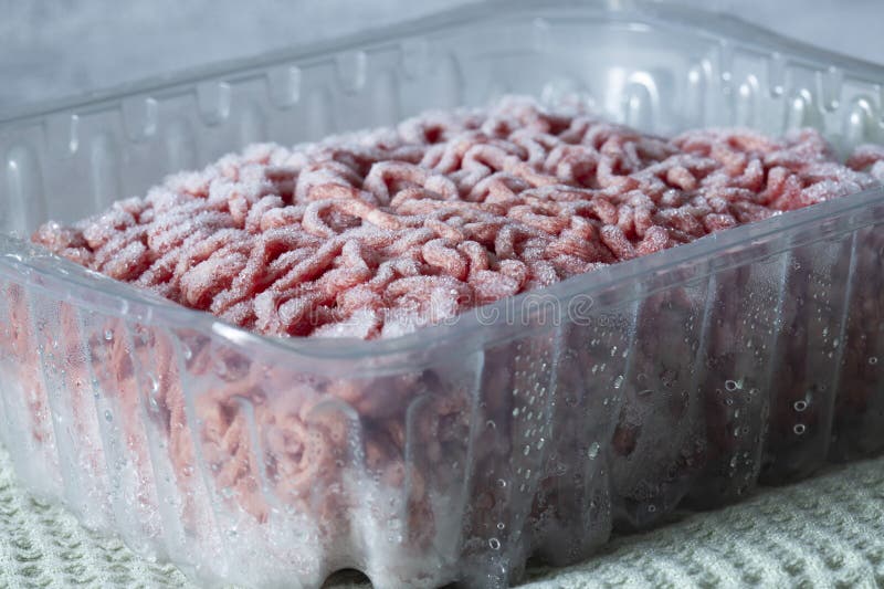 Frozen Beef Steak Mince in a Plastic Container Defrosting. Stock Image ...