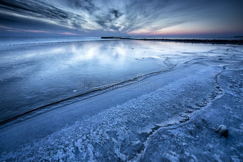 Frozen big lake in dusk stock photo. Image of winter - 243259540
