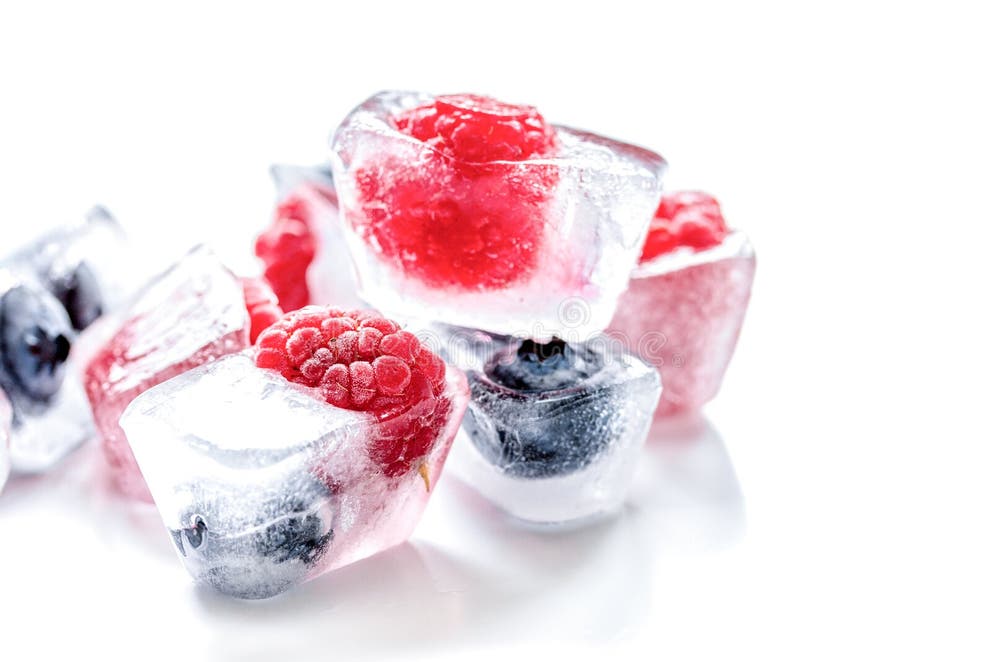 Frozen Blueberry and Raspberry in Ice Cubes on White Background Stock ...