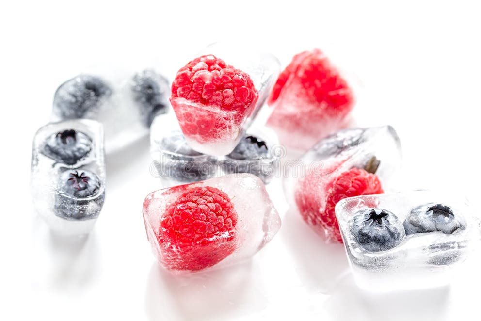 Frozen Blueberry and Raspberry in Ice Cubes on White Background Stock ...