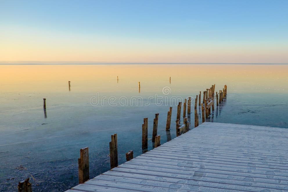 Frozen boat dock on a lake stock photo. Image of cold - 84178558