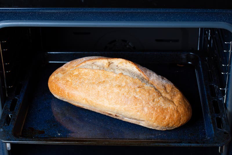 Frozen Bread in the Oven. Defrosting Bread Stock Photo - Image of ...