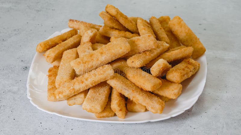 Frozen Breaded Fish Sticks Close-up on a Plate Stock Photo - Image of ...