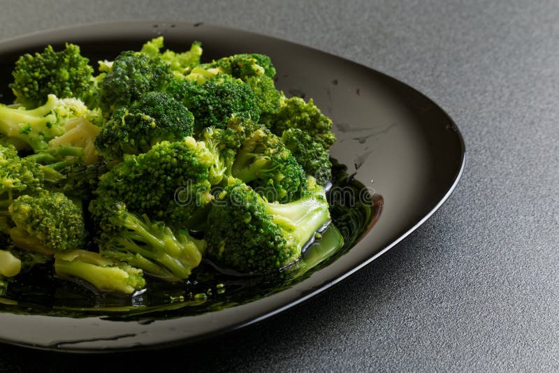 Frozen Broccoli in Black Plate Stock Photo - Image of diet, nature ...