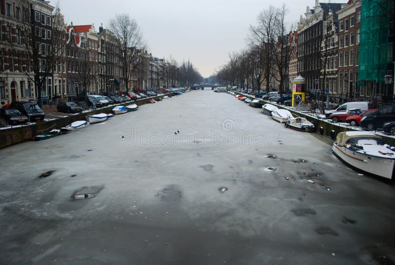 Frozen canal in Amsterdam stock image. Image of building - 57246201