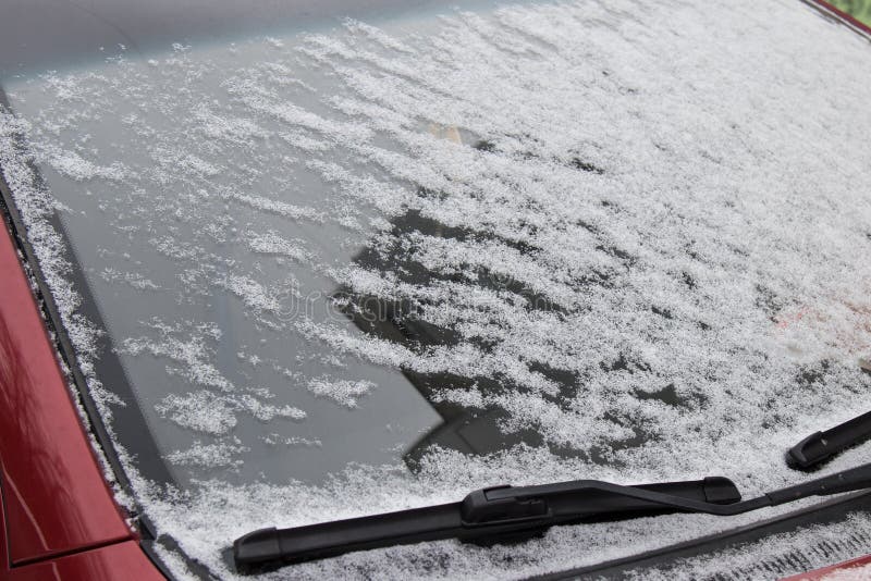 Frozen Car Windshield Covered with Ice and Snow on a Winter Day. Close ...