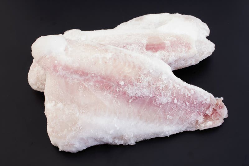 Frozen Catfish Fillets on a Black Background Stock Image - Image of ...