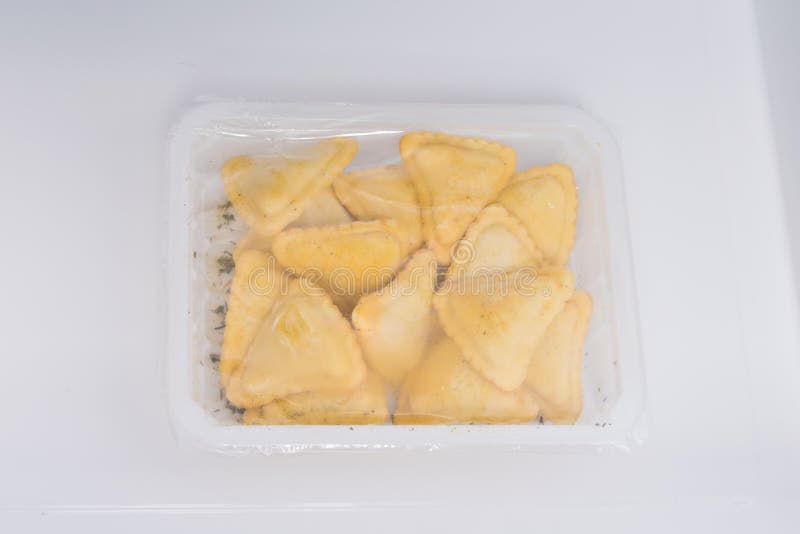 Frozen Fast Food for Deep-frying in Vacuum Packaging, Triangles with ...