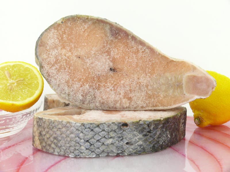 Frozen fish with lemon stock image. Image of omega, meal - 64400263