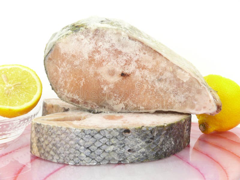 Frozen fish with lemon stock image. Image of fishing - 64400471