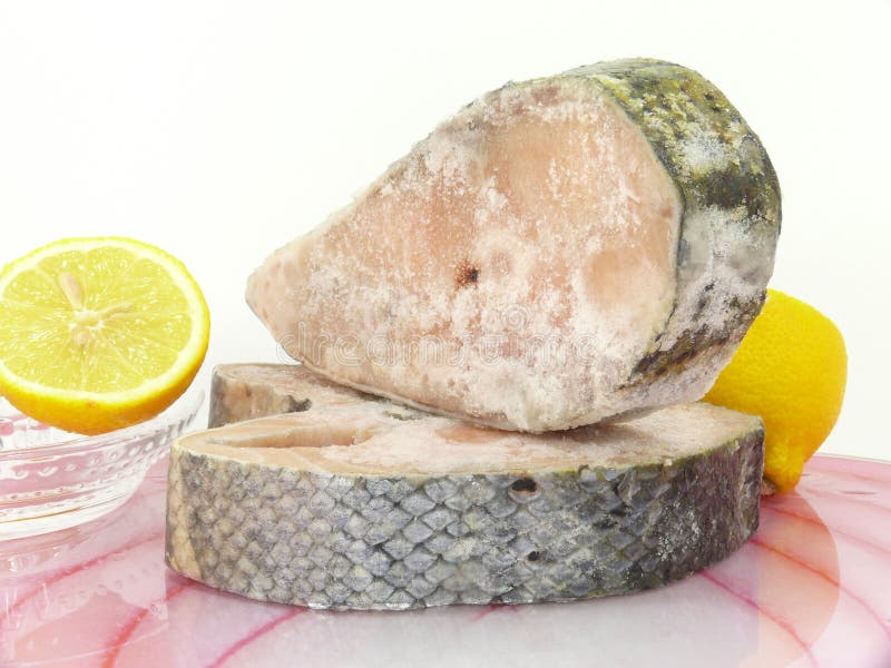 Frozen fish with lemon stock image. Image of ingredient - 64400541
