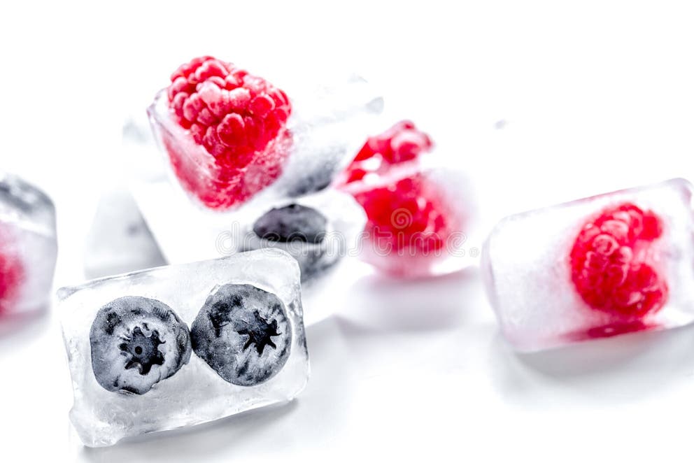 Fresh Blueberry and Raspberry in Ice on Table Background Stock Image ...