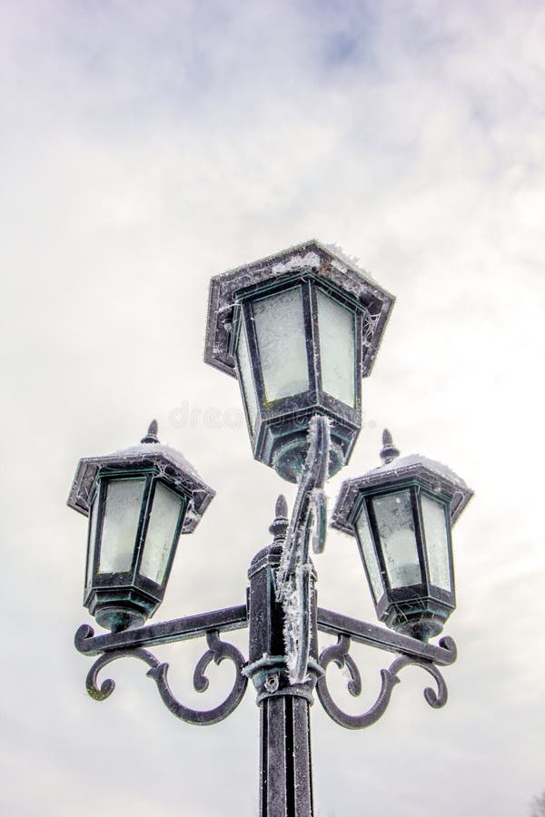Frozen and Frosty Lantern Posts with Ice and Snow Stock Photo - Image ...