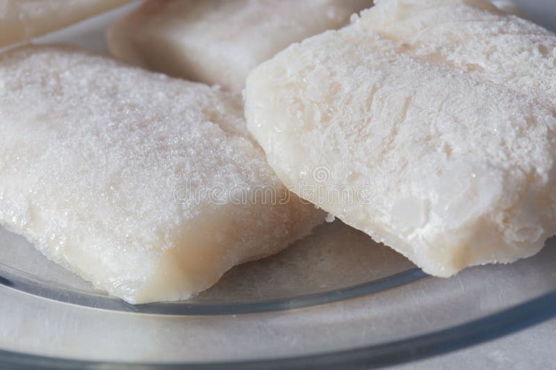 Frozen Haddock Fillets Defrosting on a Glass Plate. on a Granite ...