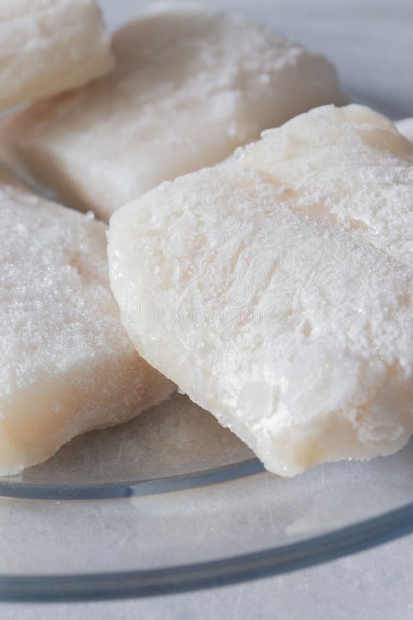 Frozen Haddock Fillets Defrosting on a Glass Plate. on a Granite ...