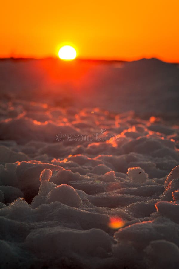 Frozen Ice Along a Beach at Sunset in Michigan Stock Image - Image of ...