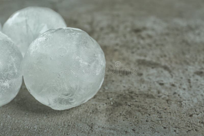 Frozen Ice Balls on Grey Table, Closeup. Space for Text Stock Image ...