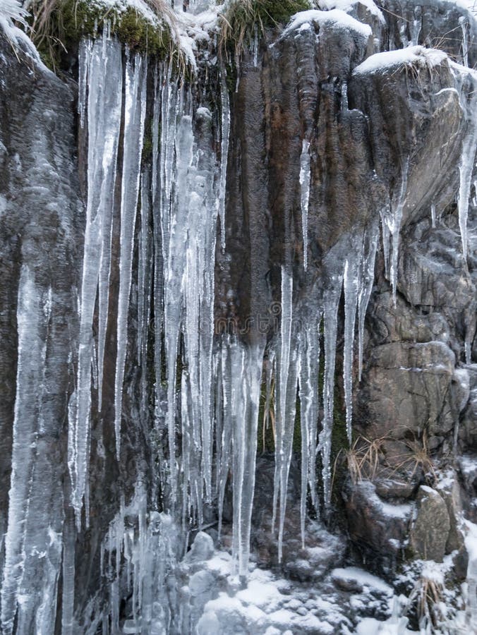 Frozen Ice Hanging Down from the Mountain Side Stock Image - Image of ...