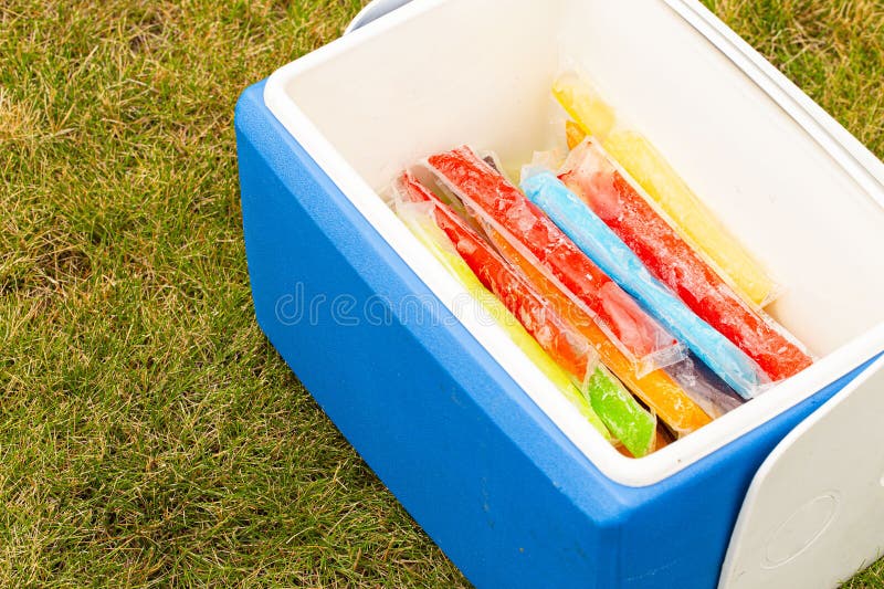 Frozen Ice Pop Popsciple in a Blue Cooler for a PIcnic Outside Stock ...