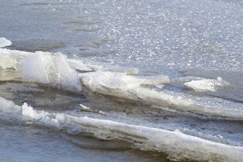 Frozen Ice and Snow by River. Spring Thawed Ice on Lake. Background ...