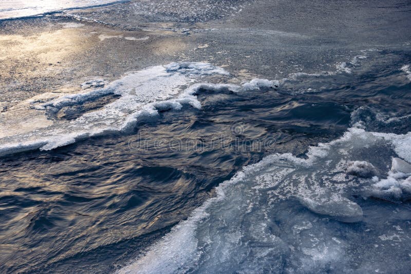 Frozen Ice and Snow in River Side. Spring Thawed Patch in the Ice Stock ...