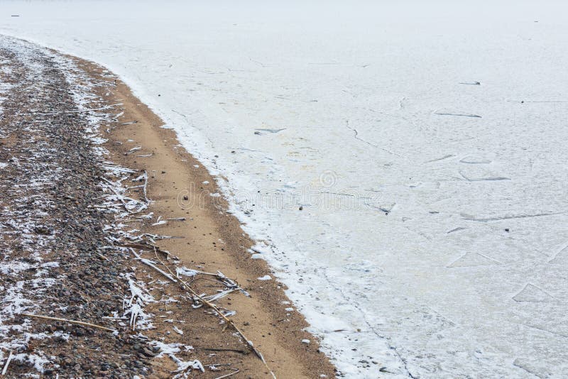 Frozen lake shore and snow stock photo. Image of abstract - 209099090