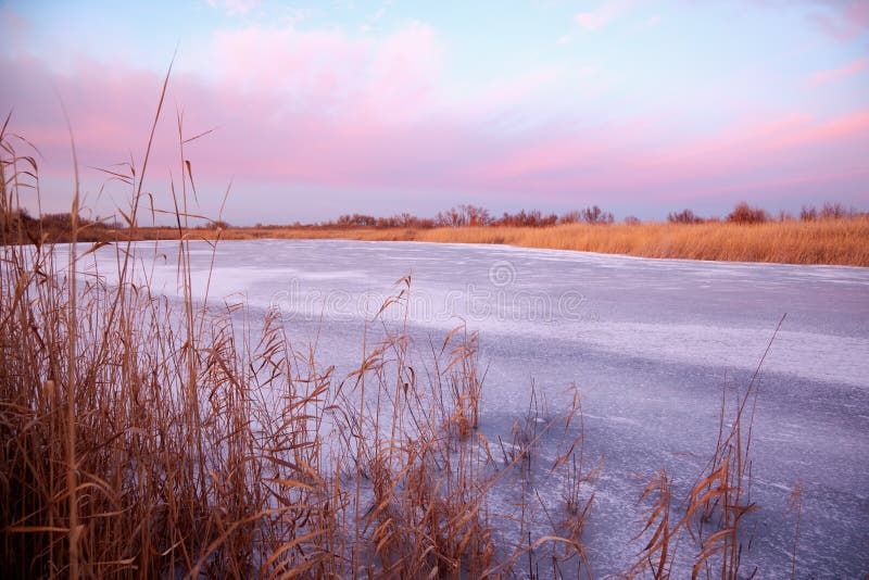 Frozen Lake at sunset stock photo. Image of clouds, snow - 12699730