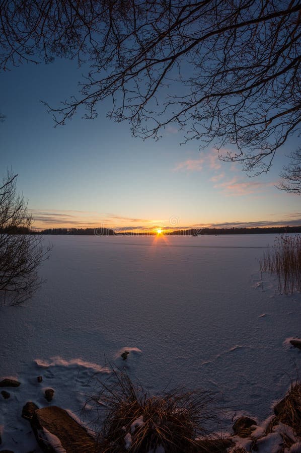 Frozen lake sunset stock photo. Image of clouds, christmas - 64724522