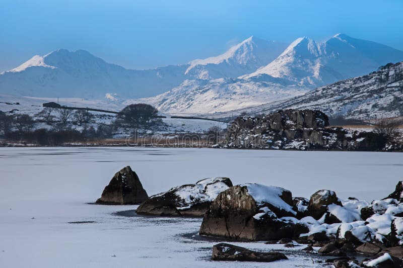 Frozen Lake - and View To Snowdon Stock Photo - Image of sunny, range ...