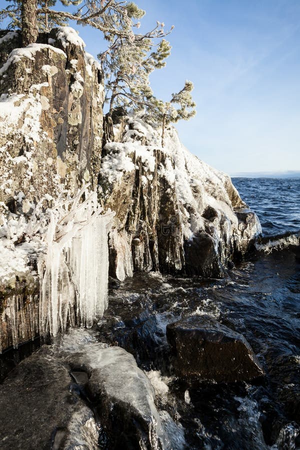Frozen Lakefront Rock Cliff Stock Image - Image of light, icicle: 60104183