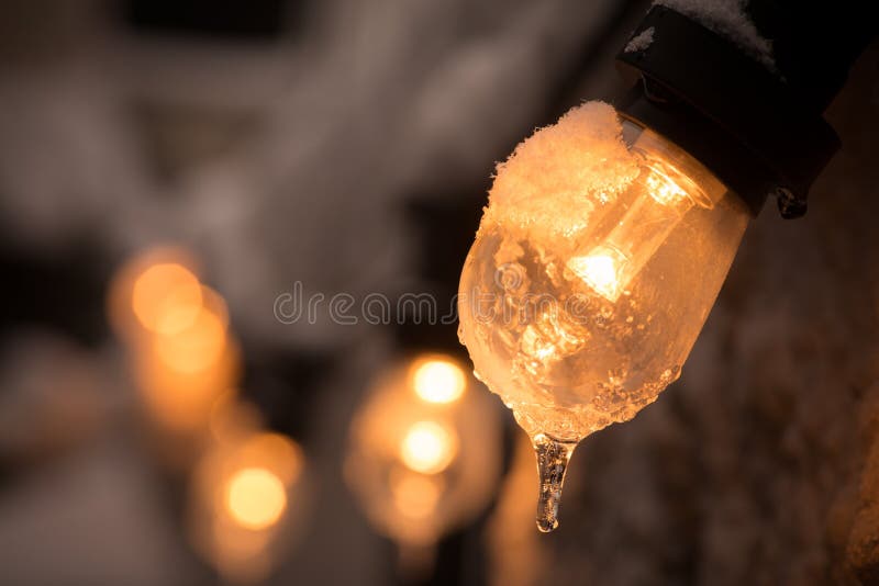 Frozen lit light bulb stock photo. Image of crystal - 137488182