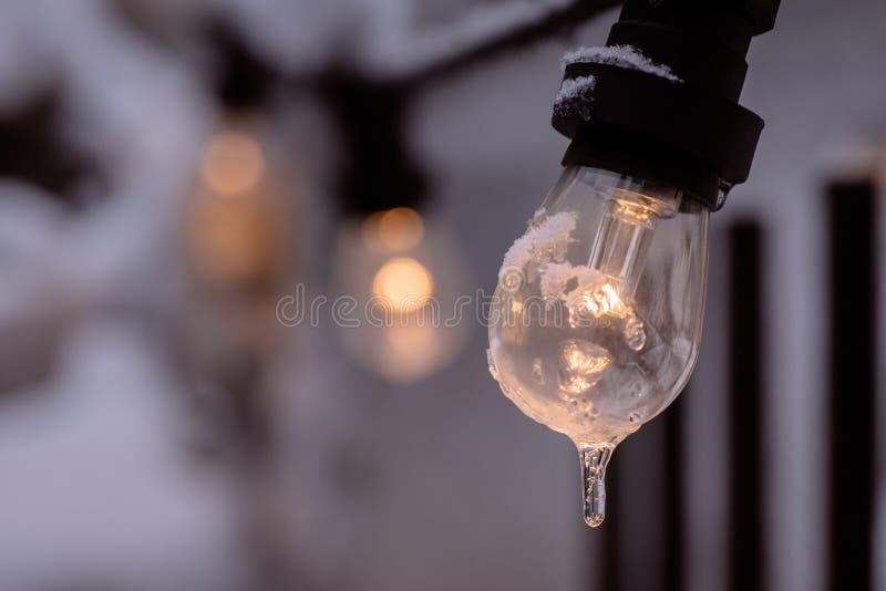 Frozen lit light bulb stock image. Image of electric - 138639665