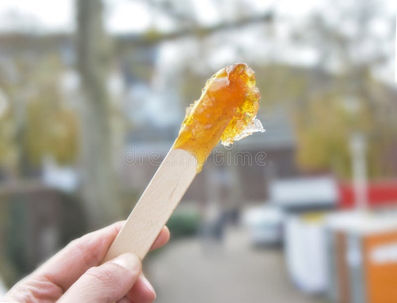 Hot Maple Syrup on a Stick in the Snow Stock Photo - Image of lolly ...