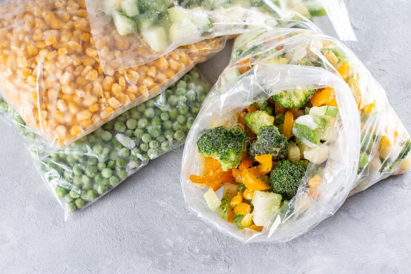 Frozen Mixed Vegetables in a Bag on a Light Concrete Background. Frozen ...