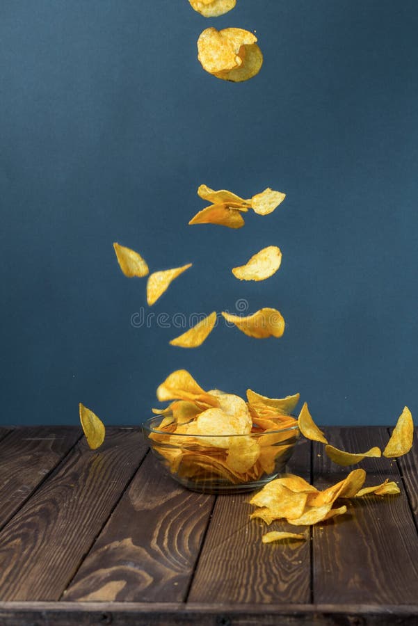 Frozen Motion. Chips Fly Over a Plate Stock Photo - Image of parts ...