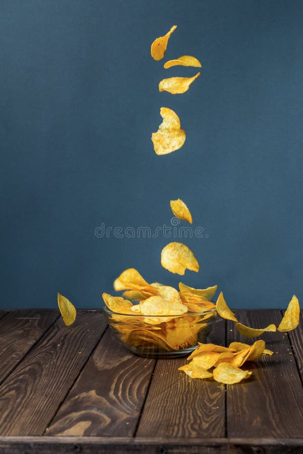 Frozen Motion. Chips Fly Over a Plate Stock Photo - Image of motion ...