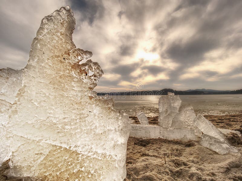 Frozen Mud, Puddle of Muddy Water. Brown Silver Ice Stock Photo - Image ...
