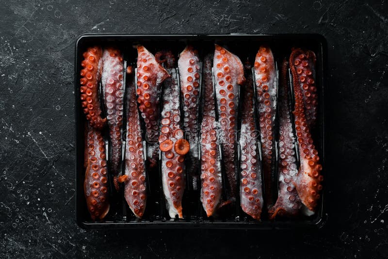 Frozen Octopus Tentacles in a Plastic Box. Stock Image - Image of ...