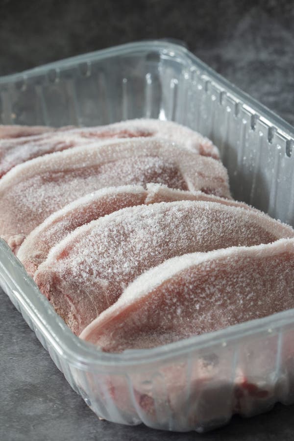 Frozen Pork Chops in Plastic Tray Packaging Thawing. Stock Image ...