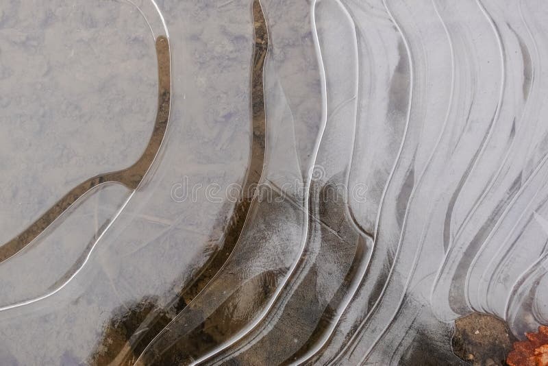 Frozen Puddle with Air Pockets and Kreative Round Forms Stock Photo ...