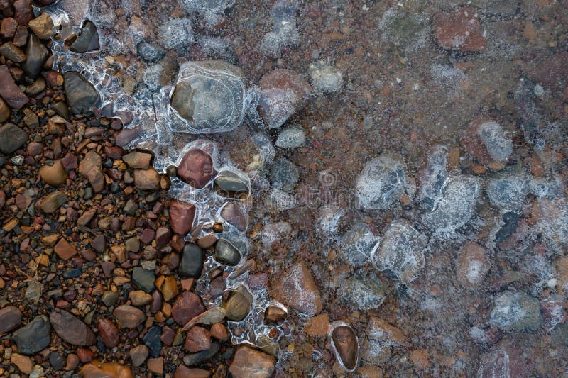 Frozen puddle on gravel stock image. Image of pebble - 321341673