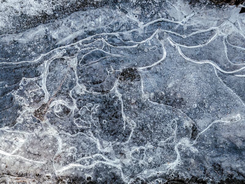 Frozen Puddle of Water Shot from Above Stock Photo - Image of light ...