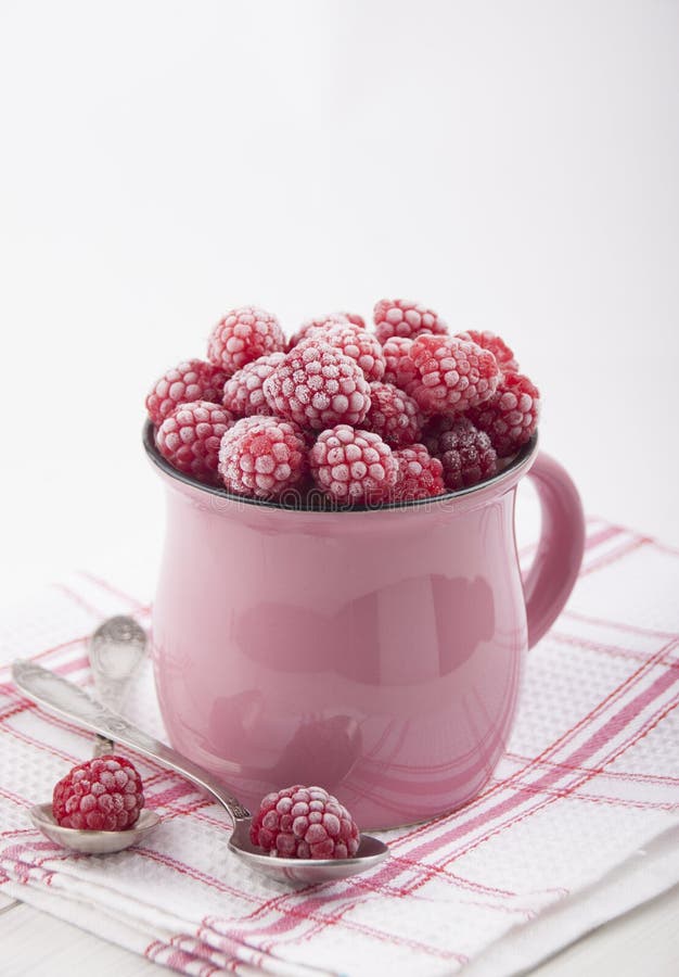 Frozen Raspberries in a Cup Stock Photo - Image of healthy, view: 103089266
