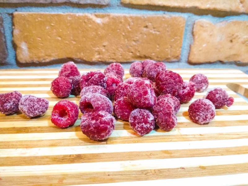 Frozen Raspberry. Close Up. Frozen Raspberries on Wooden Tables. Stock ...