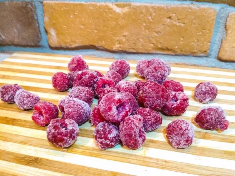 Frozen Raspberry. Close Up. Frozen Raspberries on Wooden Tables. Stock ...