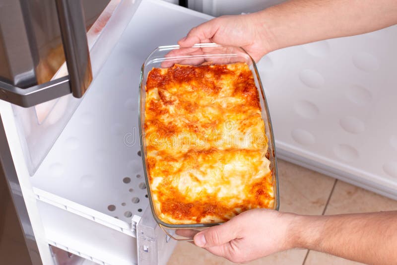 Frozen Ready Meals. Man`s Hands are Taking Frozen Lasagna from the ...