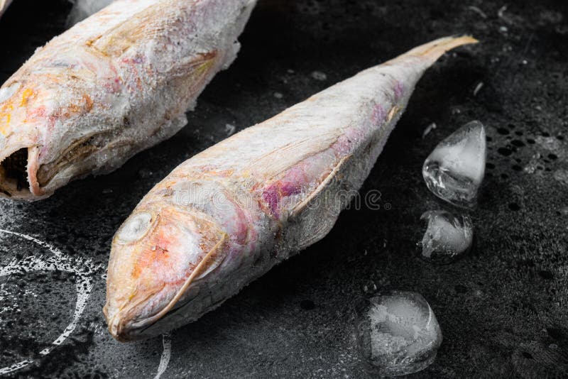 Frozen Red Mullet or Barabulka Raw Fish, on Black Dark Stone Table ...