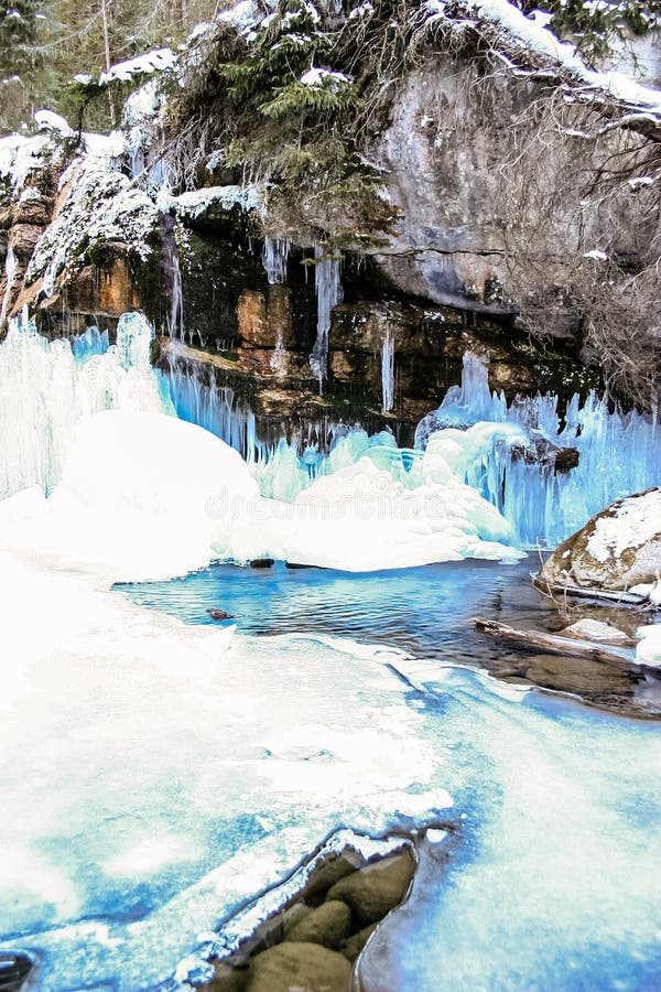 A Frozen River with Ice on it Stock Photo - Image of stalactite ...