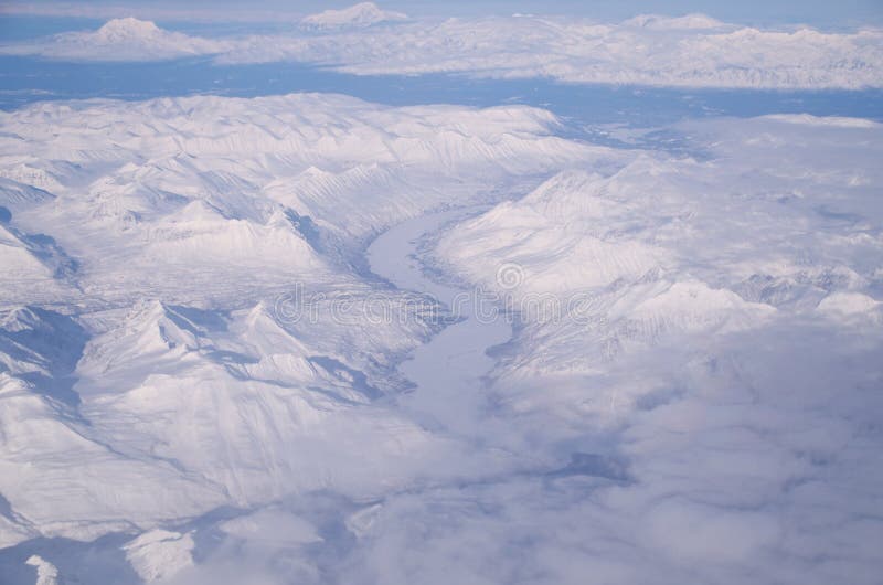 A Frozen River Running through Ice and Snow in Alaska Stock Photo ...